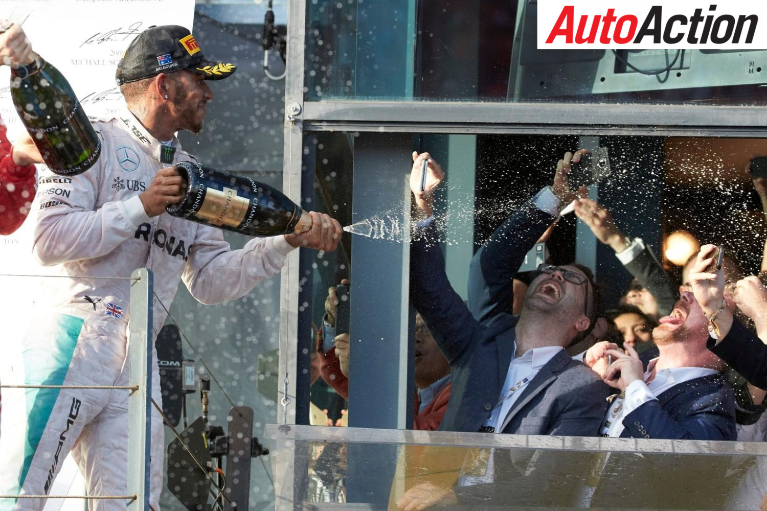 Lewis Hamilton celebrating on the podium in Australia - Auto Action